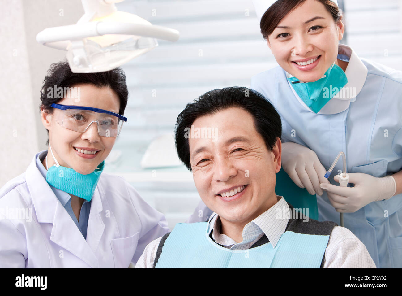 Patient receiving treatment in dental clinic Stock Photo - Alamy