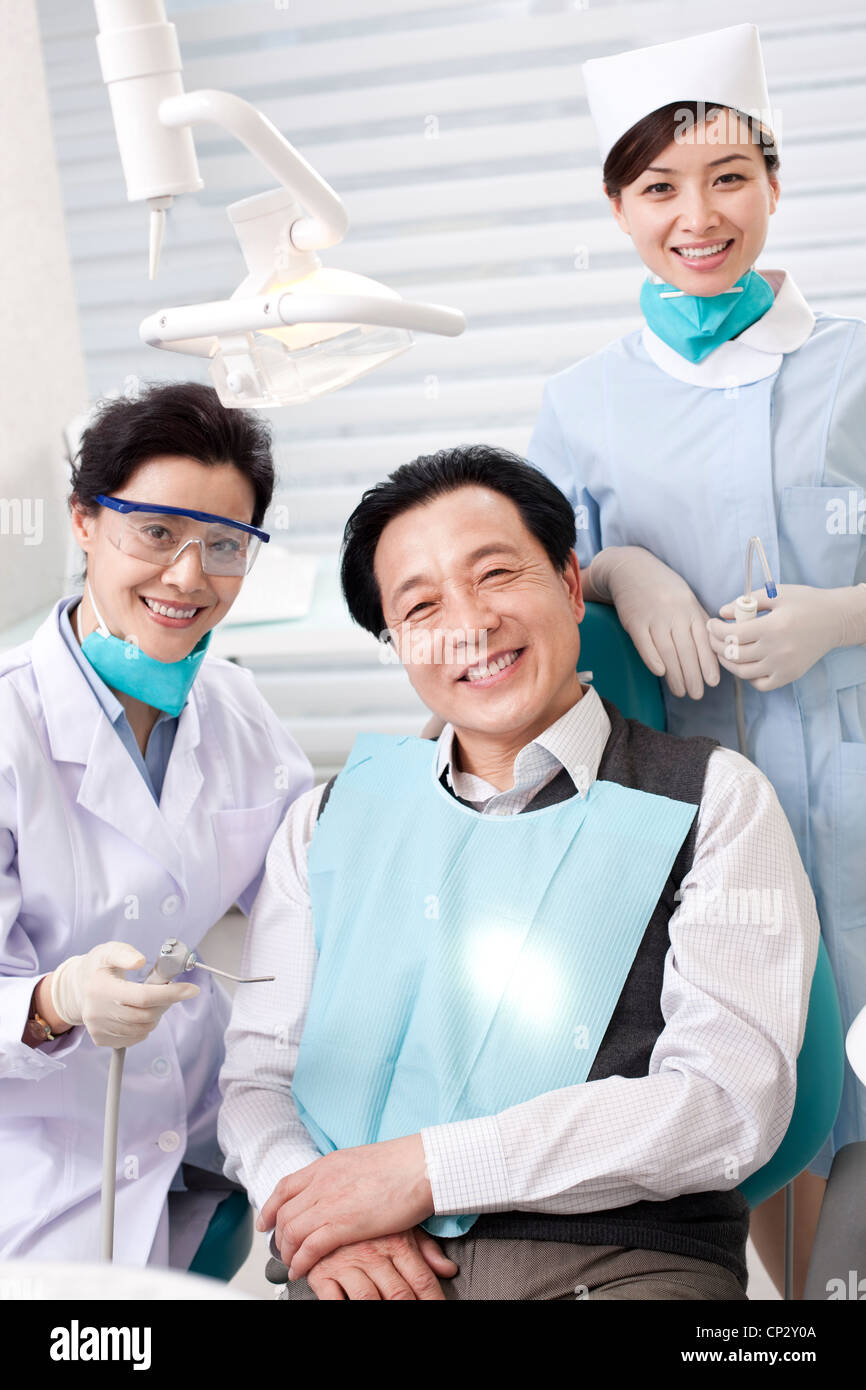 Patient receiving treatment in dental clinic Stock Photo - Alamy