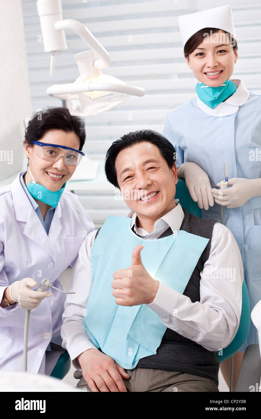 Patient receiving treatment in dental clinic Stock Photo - Alamy