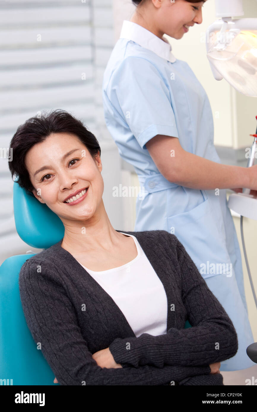 Patient receiving treatment in dental clinic Stock Photo - Alamy