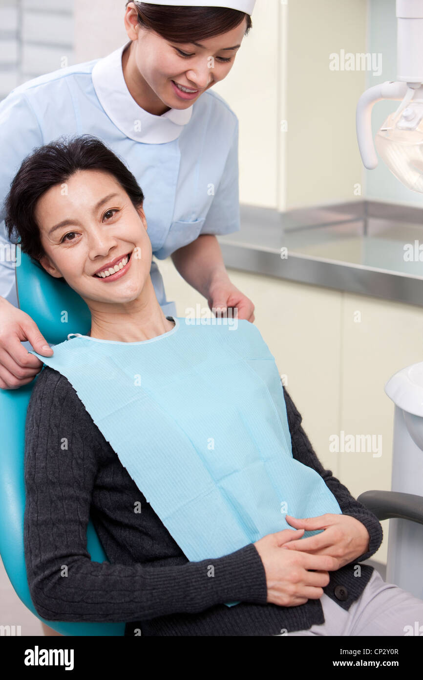Cheerful patient receiving dental care hi-res stock photography and ...