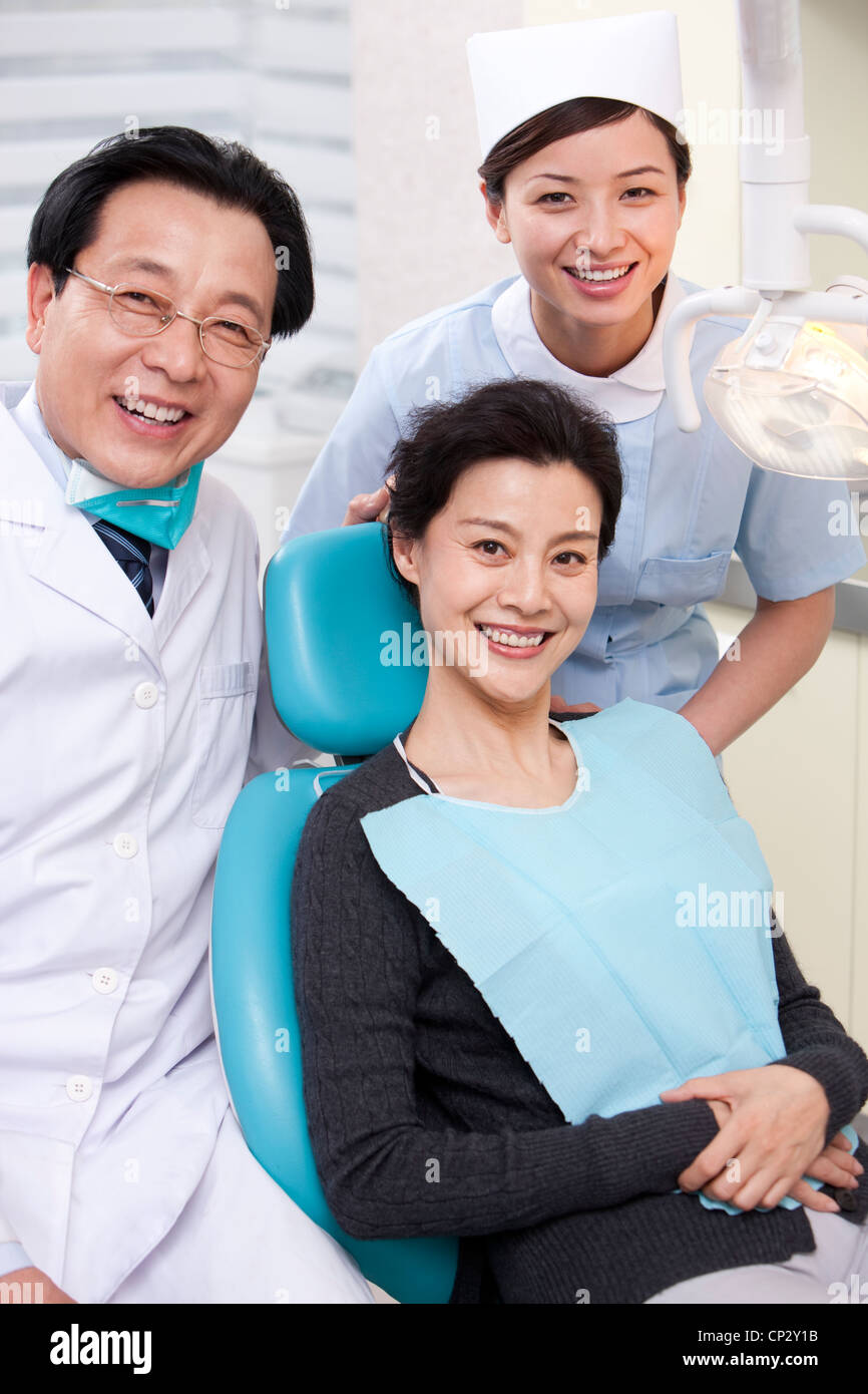 Patient receiving treatment in dental clinic Stock Photo - Alamy