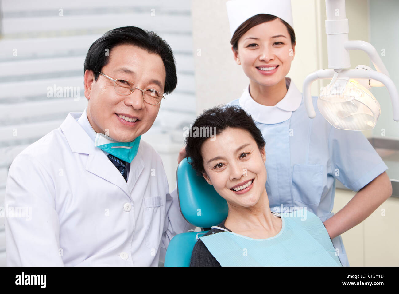 Patient receiving treatment in dental clinic Stock Photo - Alamy