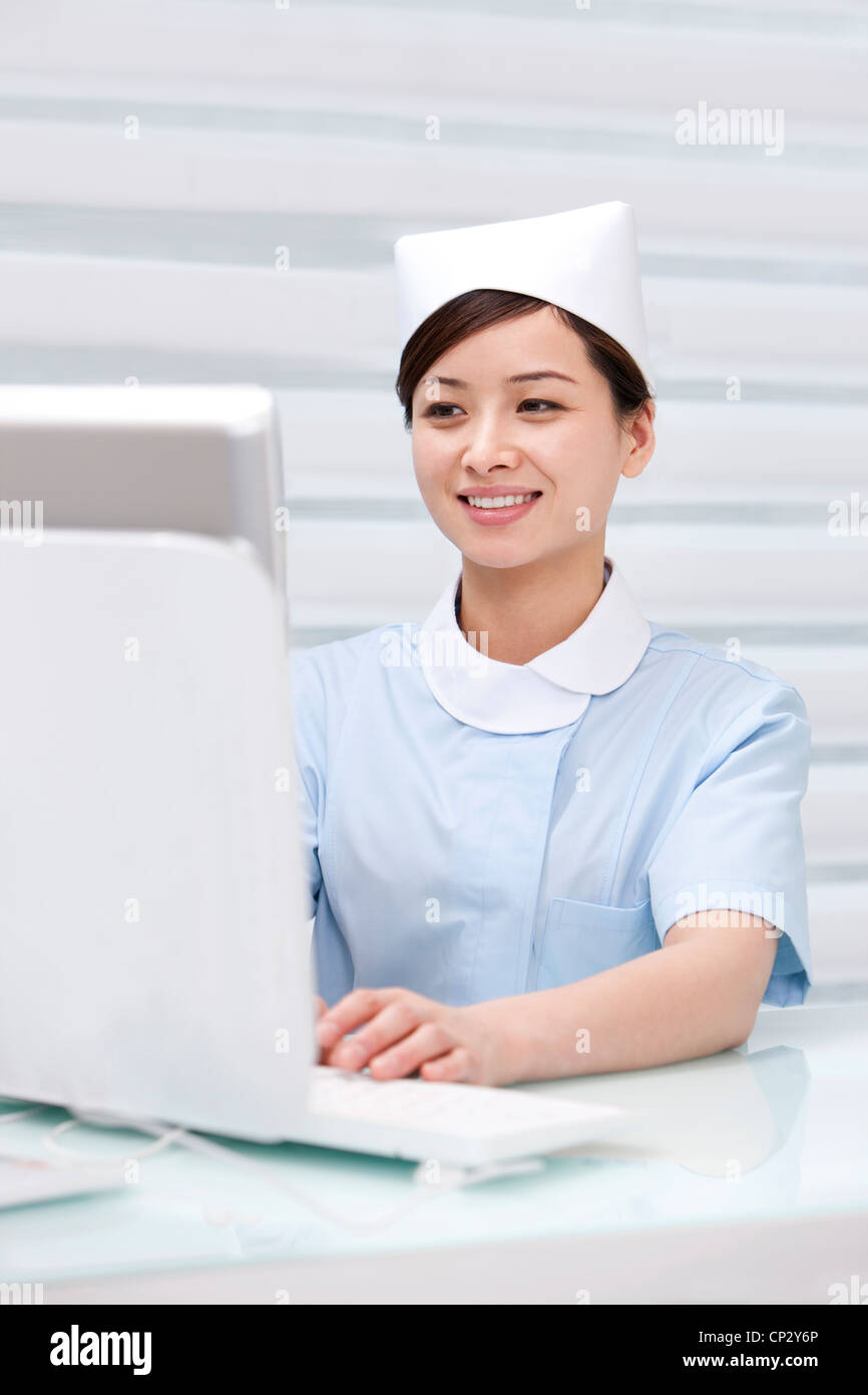 Nurse using computer in hospital Stock Photo - Alamy