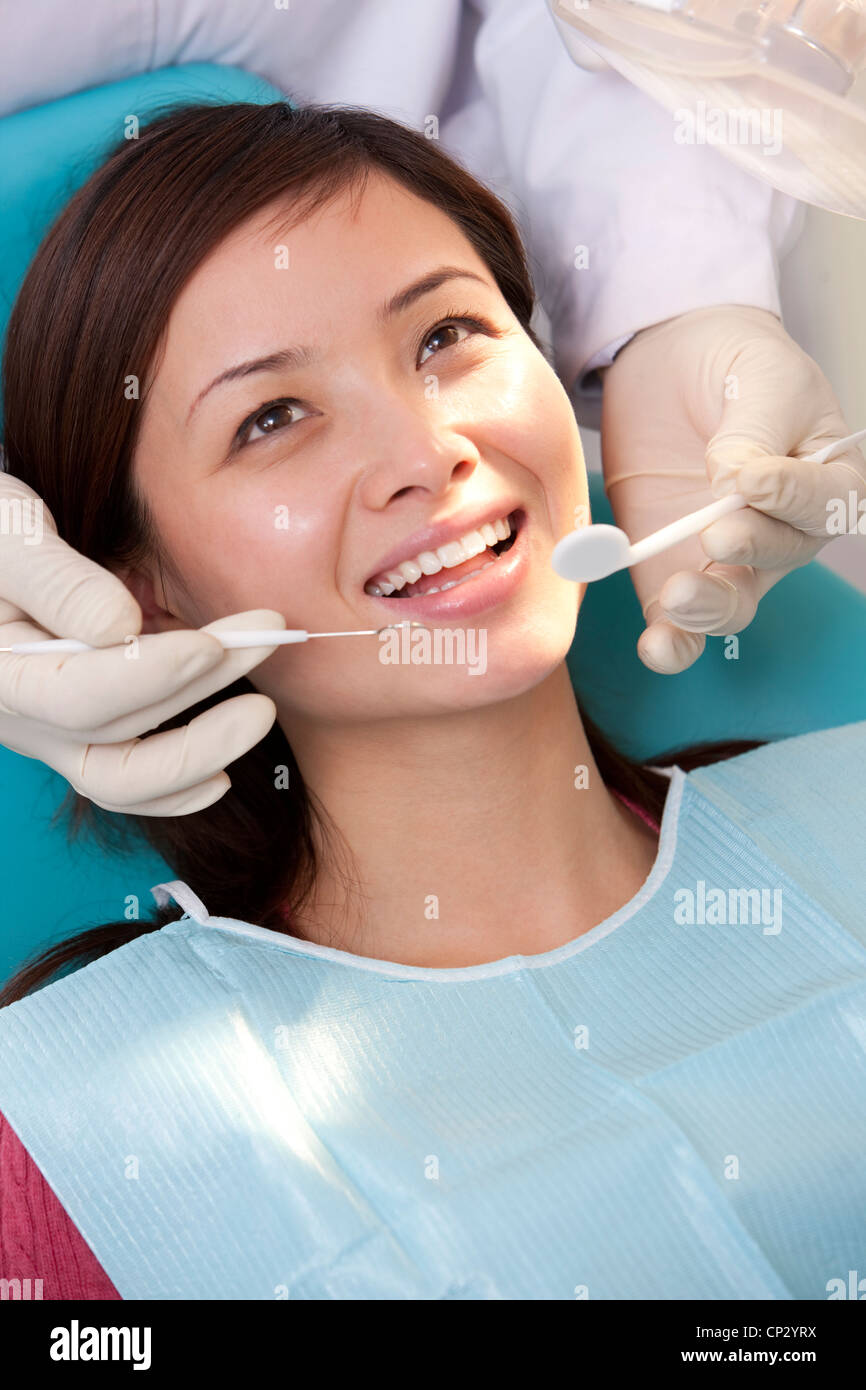 Patient receiving treatment in dental clinic Stock Photo - Alamy