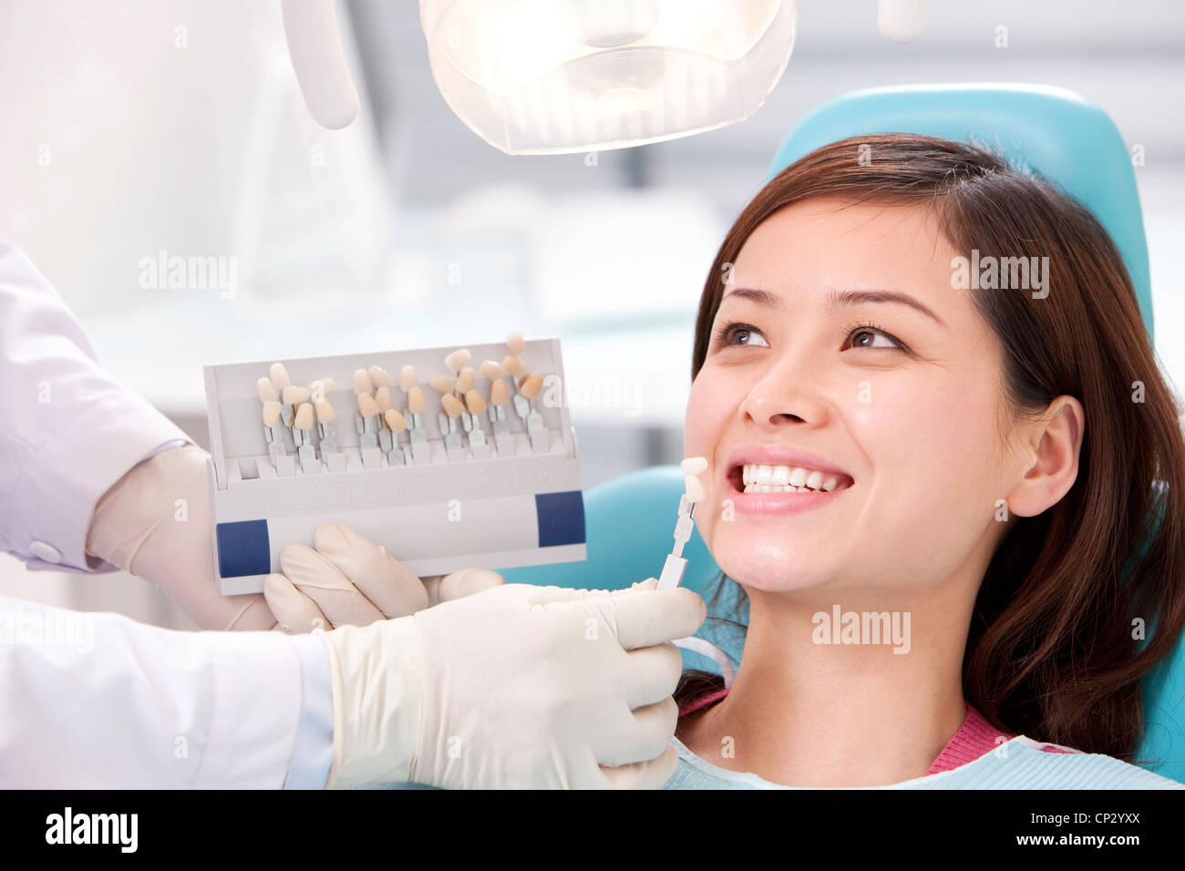 Patient receiving treatment in dental clinic Stock Photo - Alamy