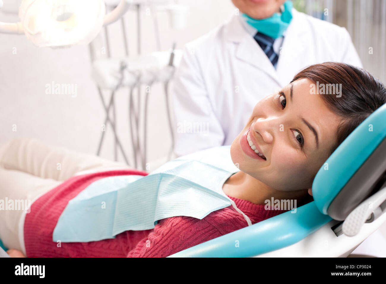 Patient receiving treatment in dental clinic Stock Photo - Alamy