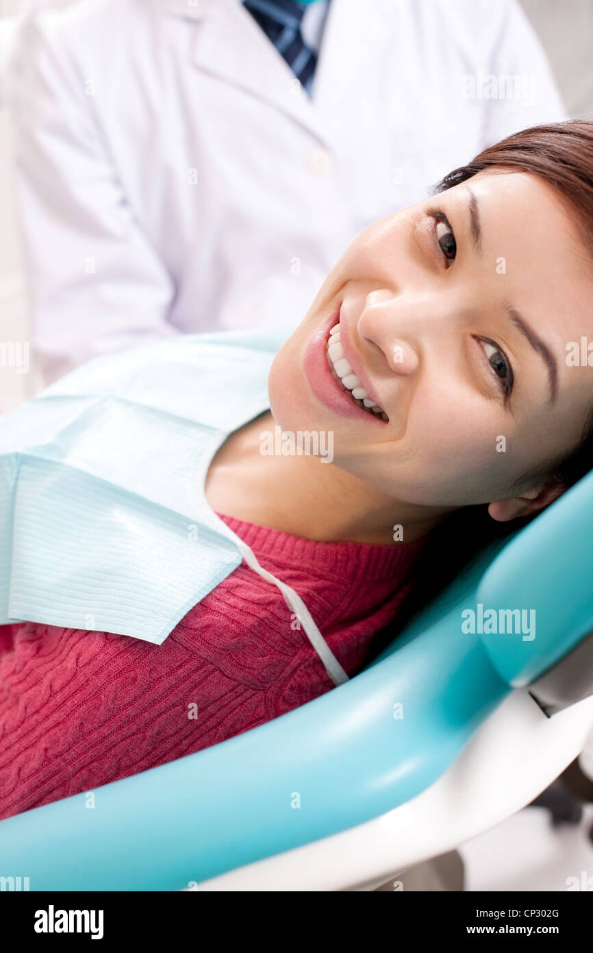 Patient receiving treatment in dental clinic Stock Photo - Alamy