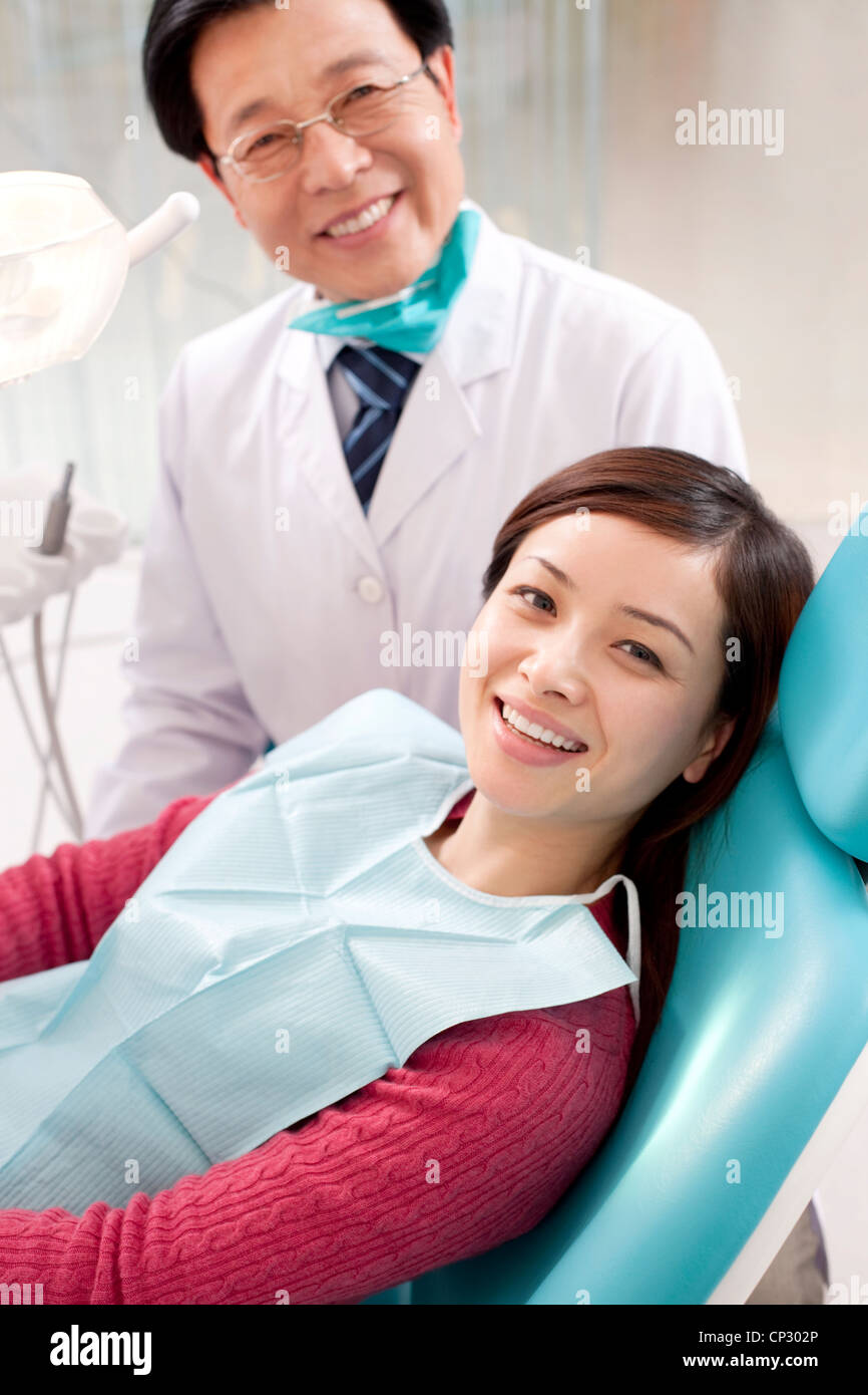 Patient receiving treatment in dental clinic Stock Photo - Alamy