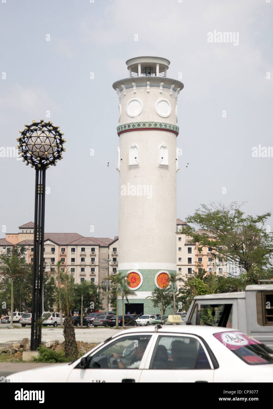 It's a round tower in the street of a city. It looks like an old ...