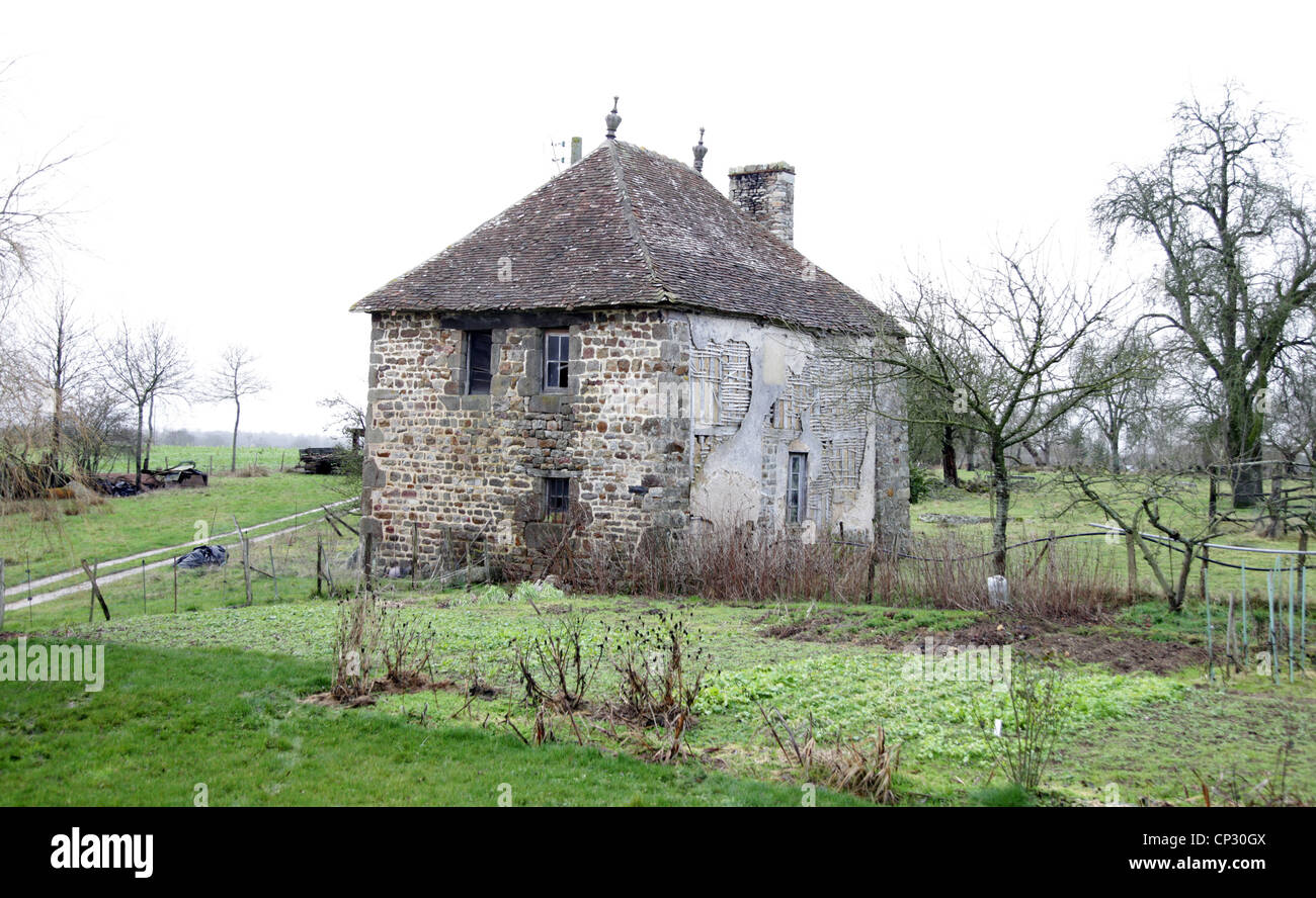 It's a photo of an old house in stone in Normandy in countryside of ...