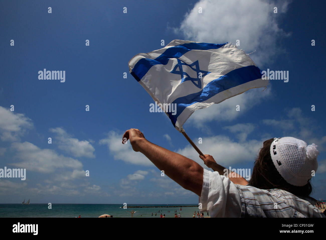 A religious Jew wearing "Breslov" typical white "Na Nacher" style ...