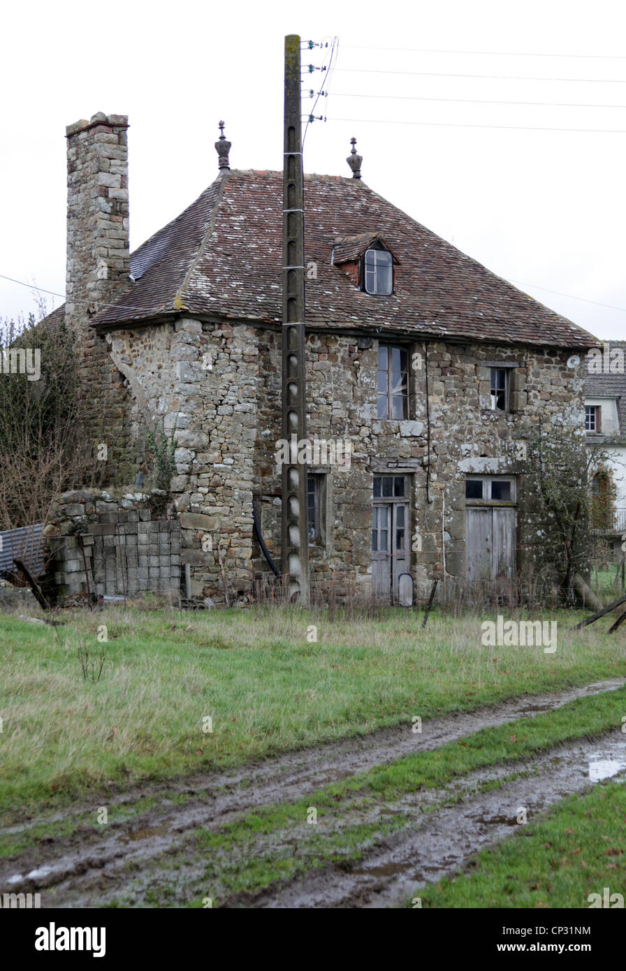 It's a photo of an old house in stone in Normandy in countryside of ...