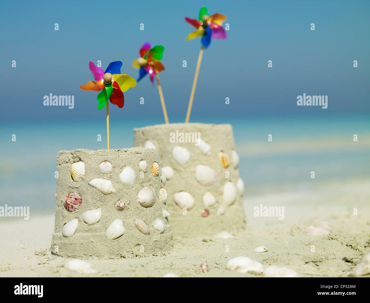 sand castles covered in shells on a beach Stock Photo - Alamy