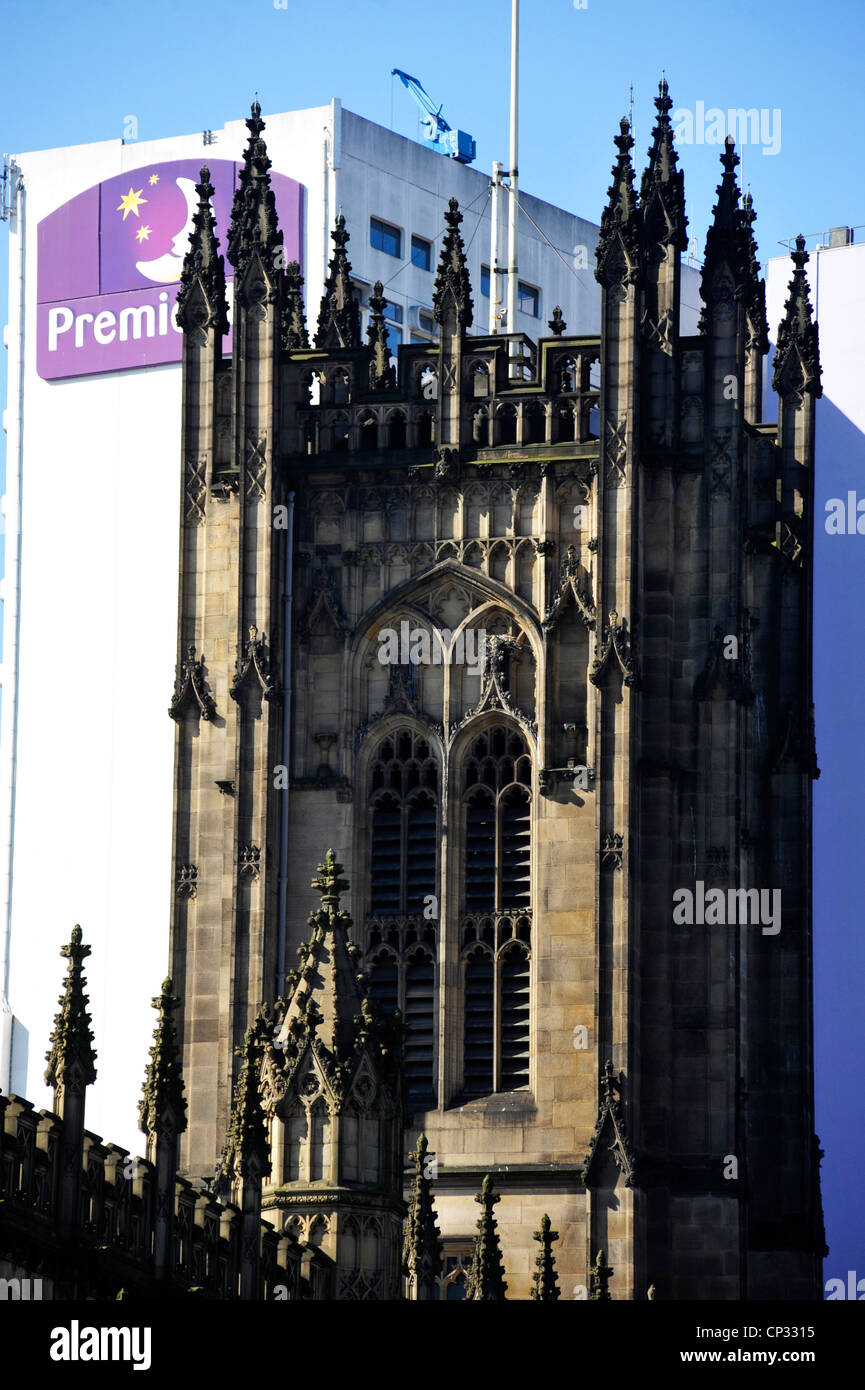 Old and new building in Manchester. The Premier Inn hotel behind ...