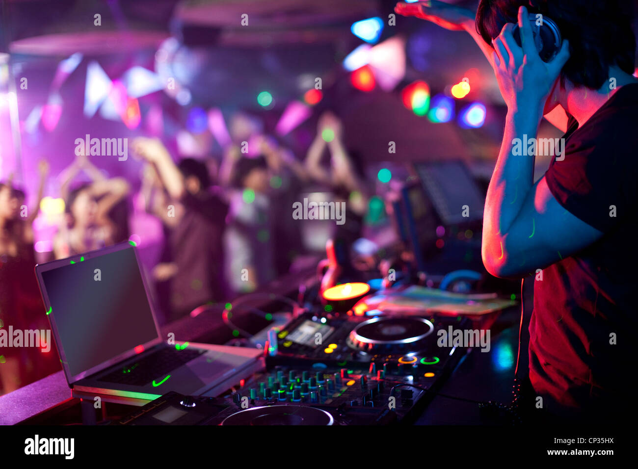 DJ doing record Scratching in nightclub Stock Photo - Alamy
