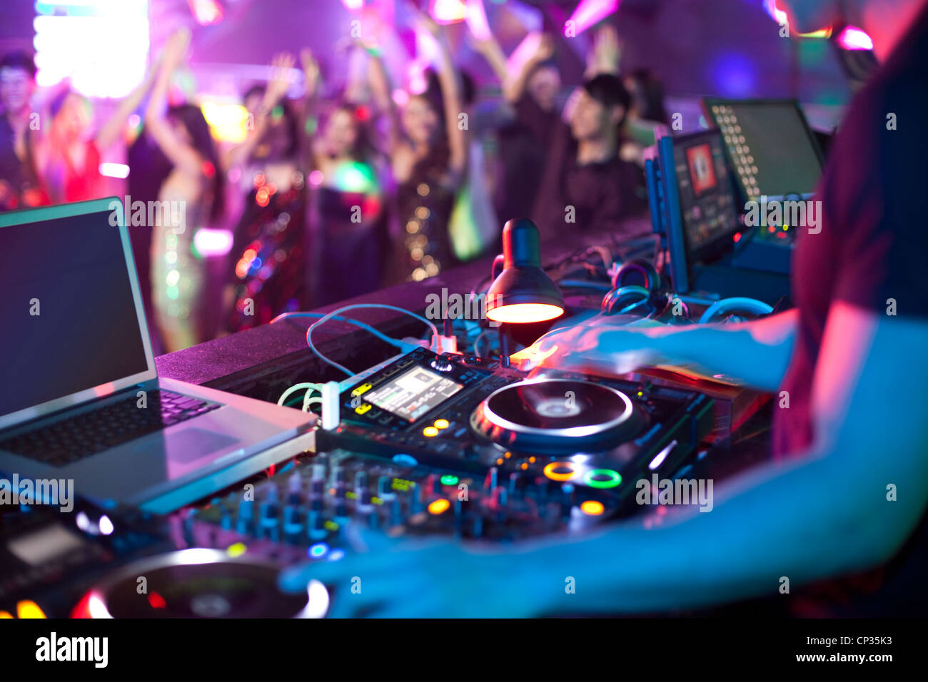 DJ doing record Scratching in nightclub Stock Photo - Alamy