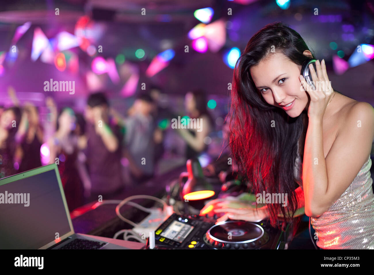 DJ doing record Scratching in nightclub Stock Photo - Alamy