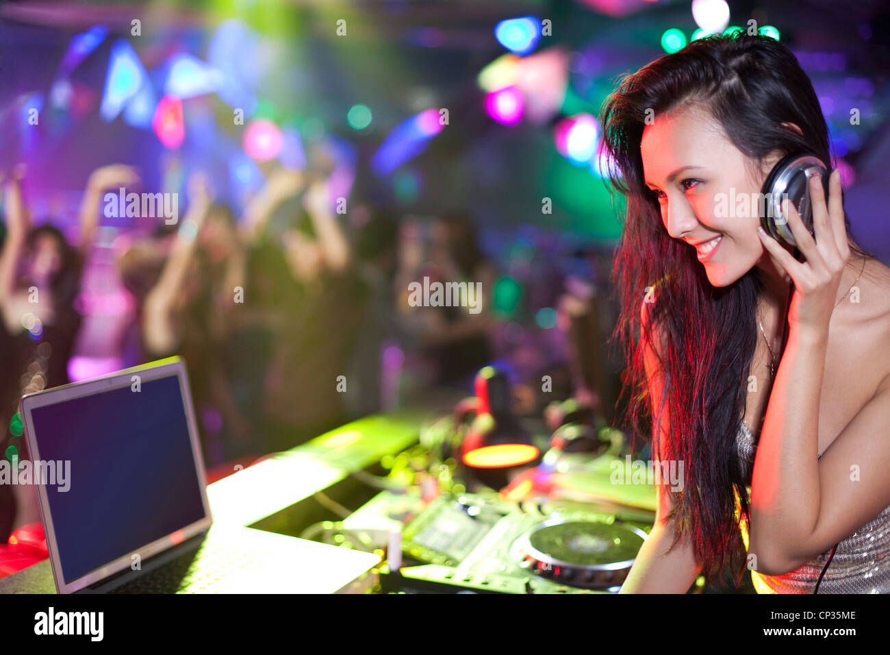 DJ doing record Scratching in nightclub Stock Photo - Alamy