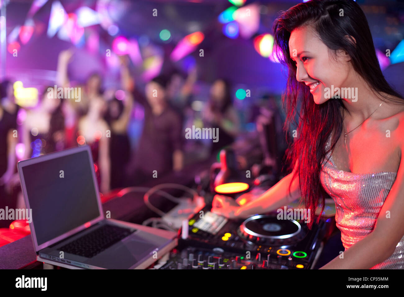 DJ doing record Scratching in nightclub Stock Photo - Alamy