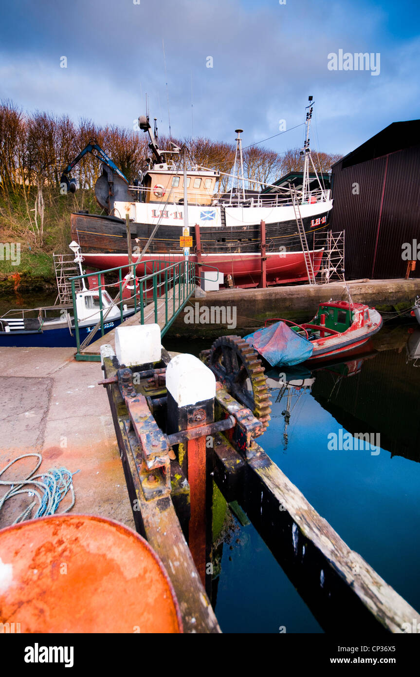 A small shipyard at Eyemouth on the south east coast of Scotland Stock ...