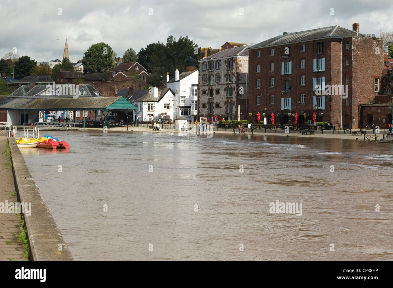 The River Exe overflowing into Exeter's flood relief and breaking the ...