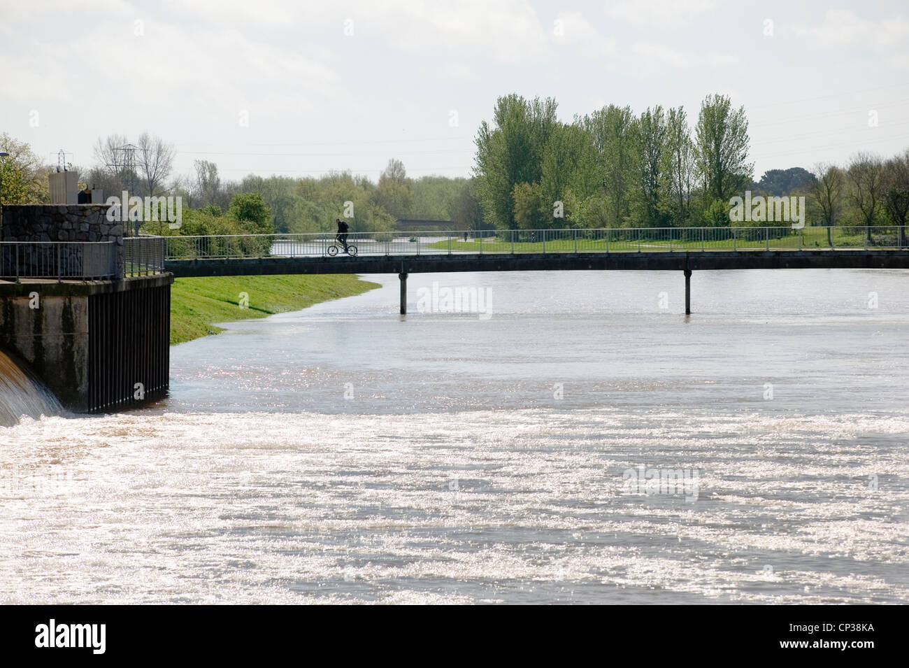 The River Exe overflowing into Exeter's flood relief and breaking the ...
