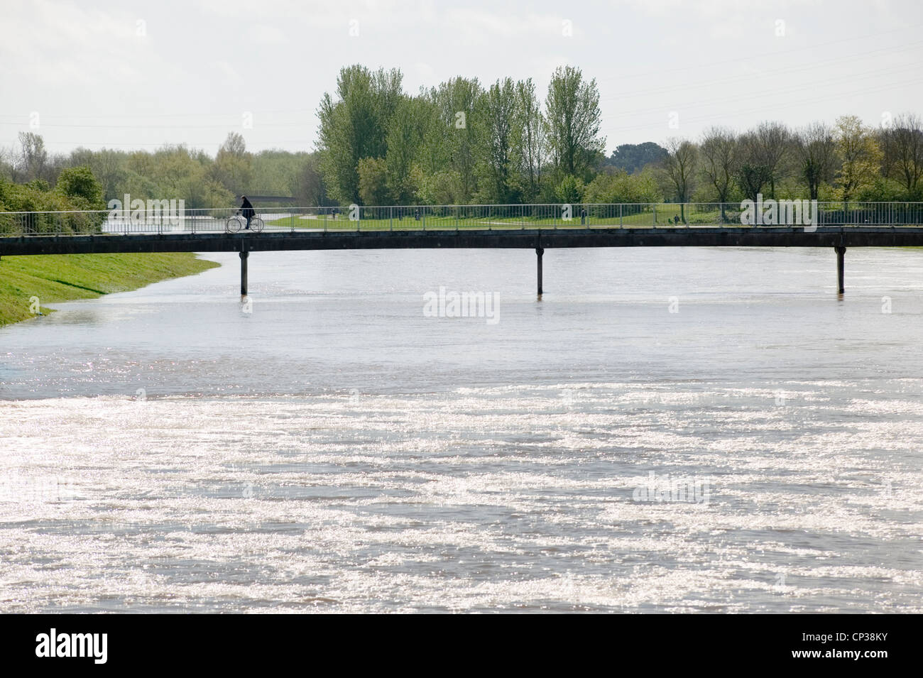 The River Exe overflowing into Exeter's flood relief and breaking the ...