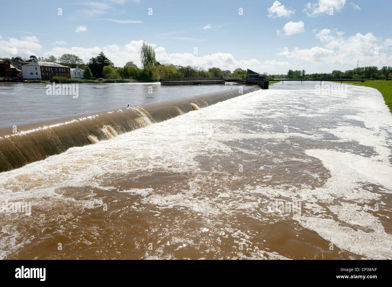 The River Exe overflowing into Exeter's flood relief and breaking the ...