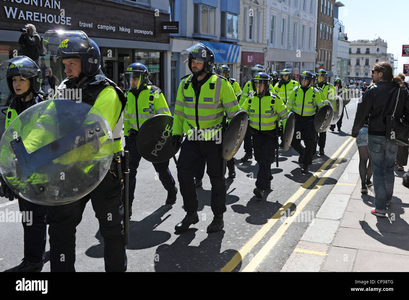 Riot police running along a street in Brighton UK Stock Photo - Alamy