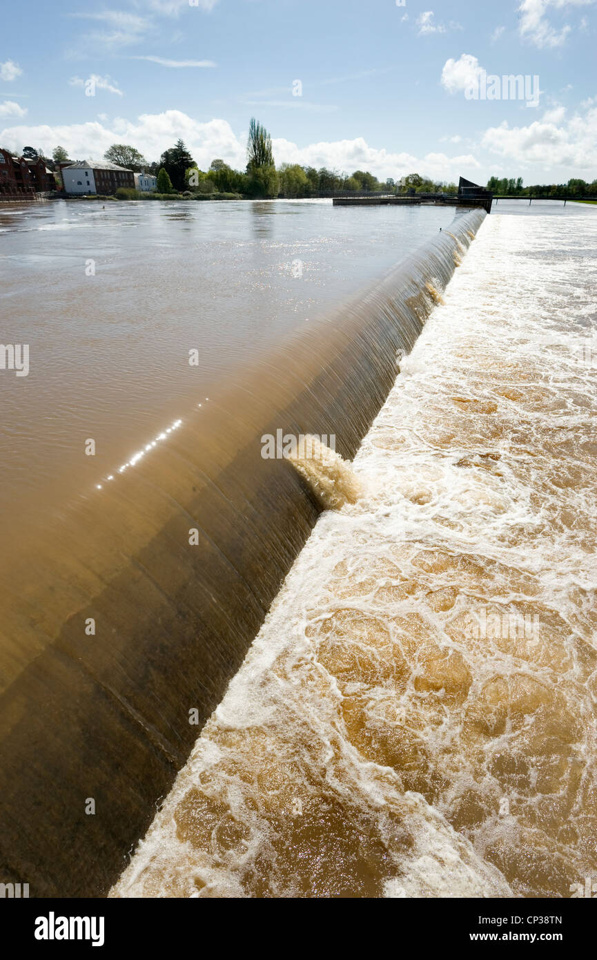 The River Exe overflowing into Exeter's flood relief and breaking the ...