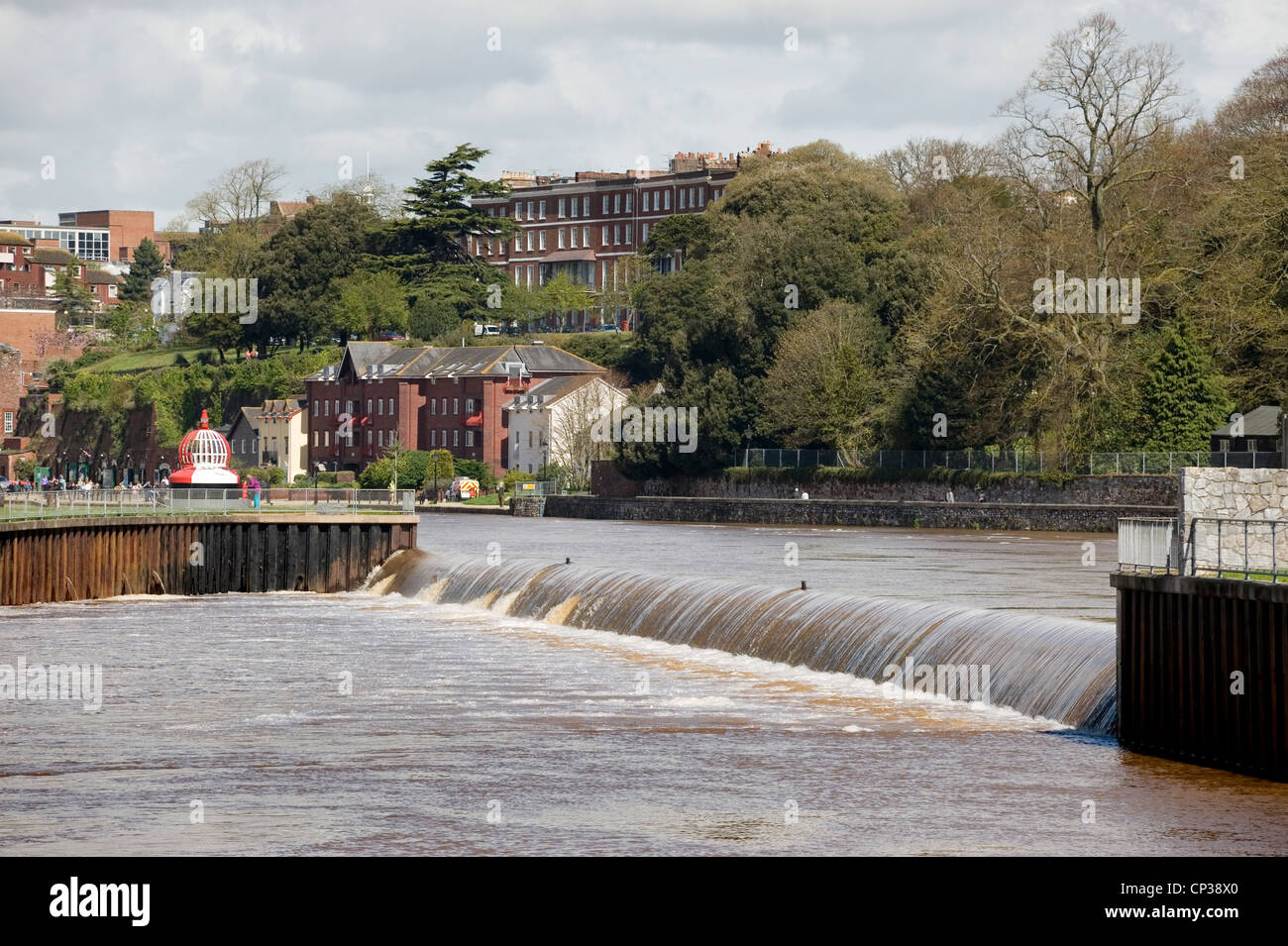 The River Exe overflowing into Exeter's flood relief and breaking the ...