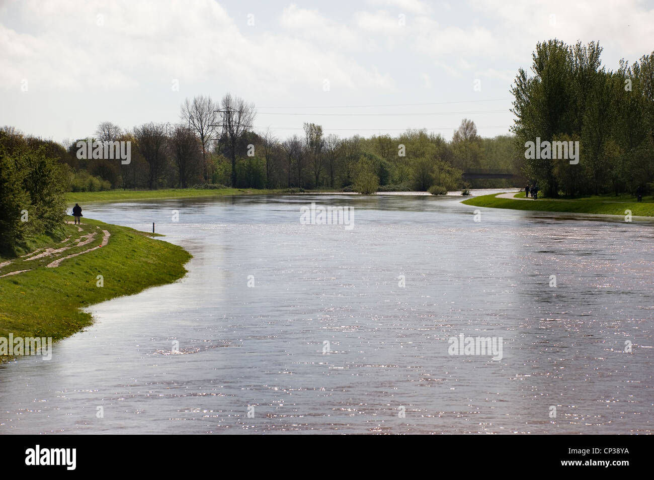 The River Exe overflowing into Exeter's flood relief and breaking the ...