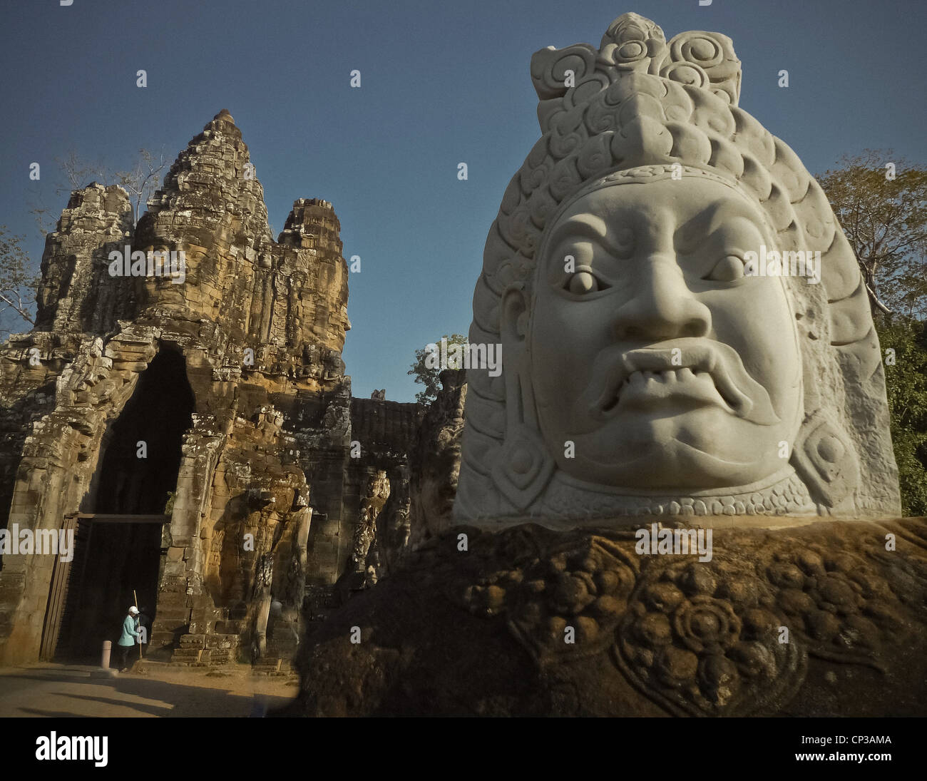 Angkor Thom, Gods and Demons, Demon head under renovation. The Naga and ...