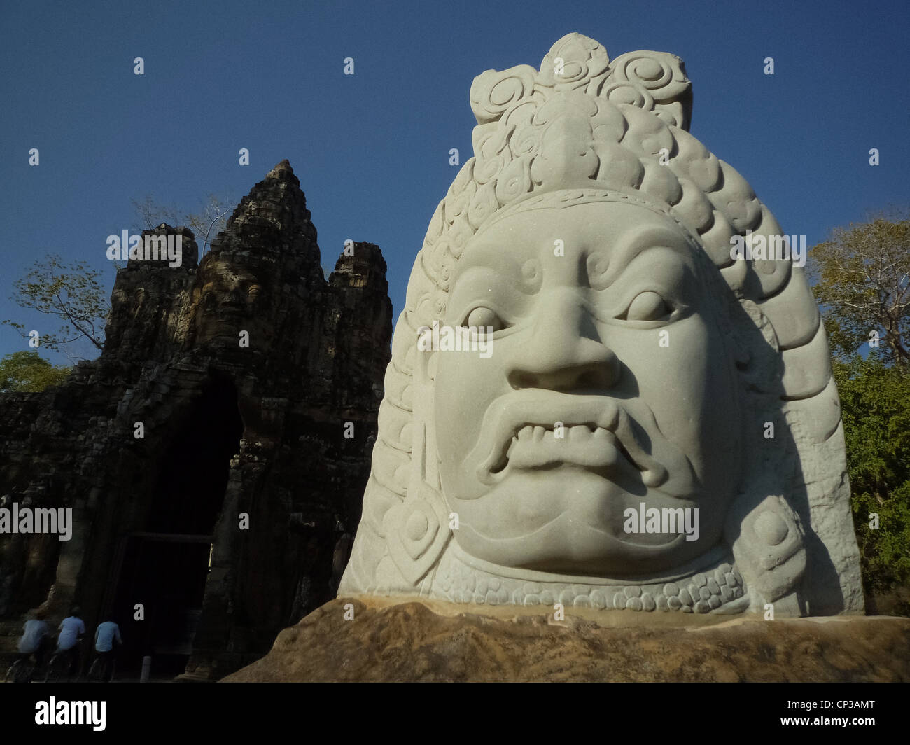 Angkor Thom, Gods and Demons, Demon head under renovation. The Naga and ...