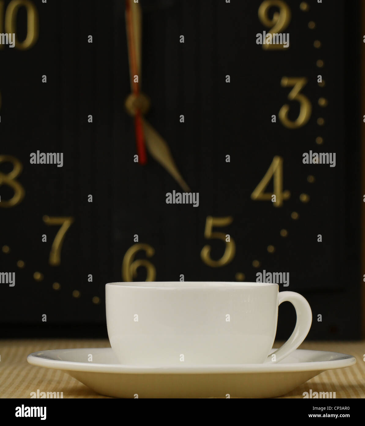 cup of tea on the background of clock the concept of 5 o'clock Stock ...
