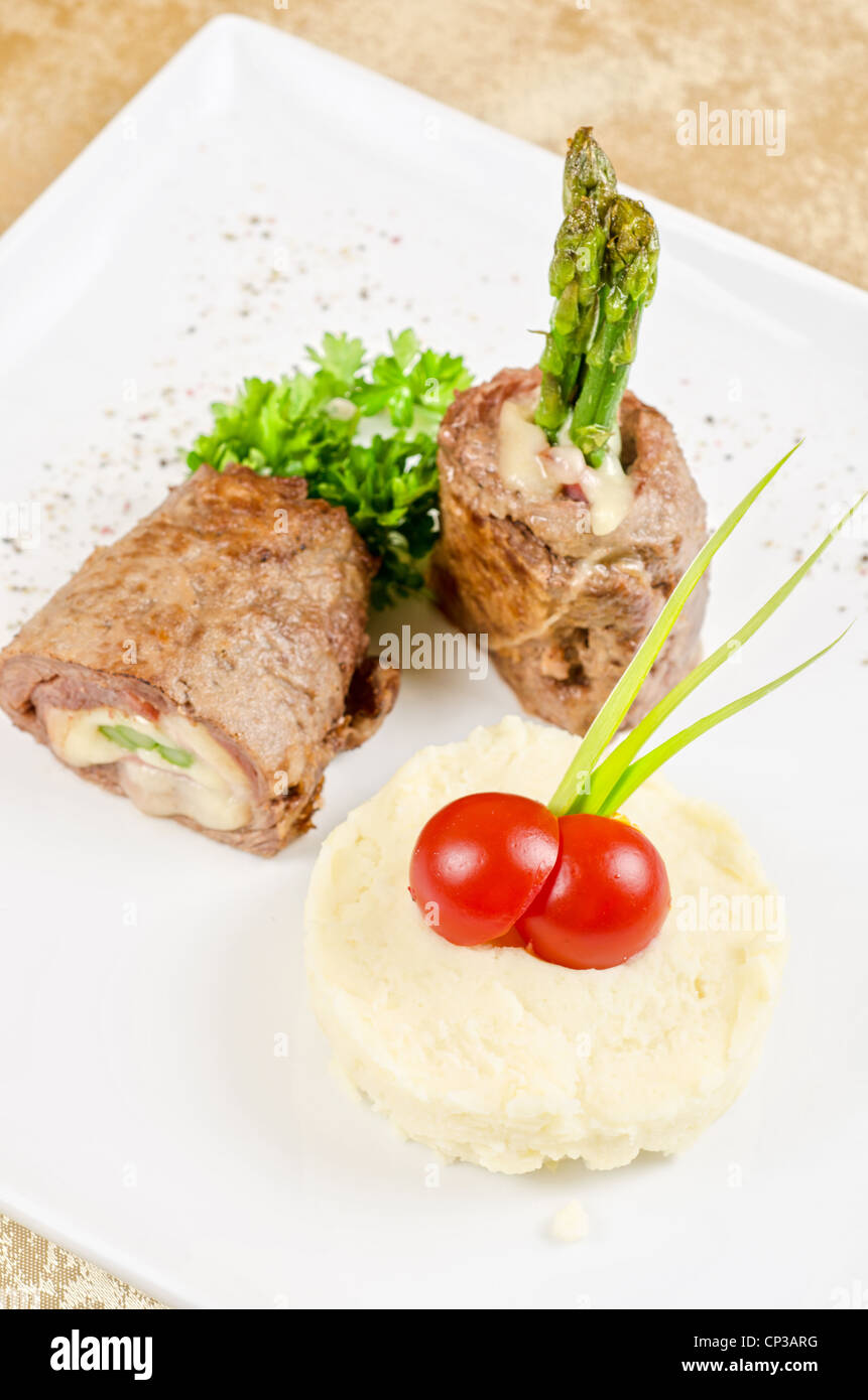 Grilled meat rolls from beef meat with mozzarella, ham, asparagus and ...