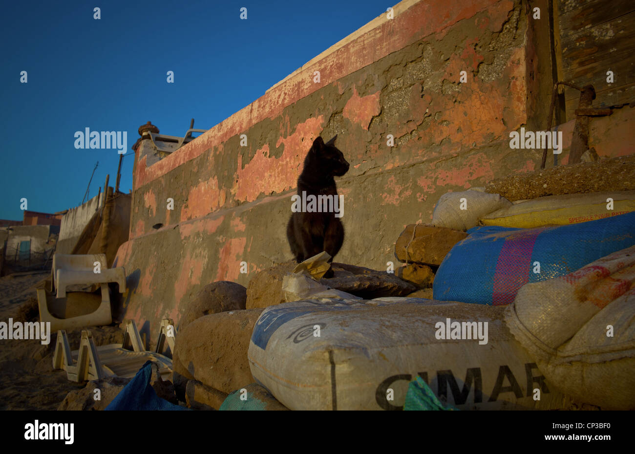 The village of Tifnit, The locksmith cat (his shadow in a shape of a ...