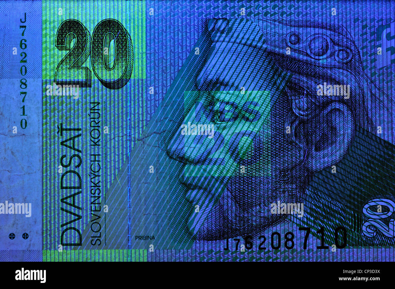 Banknote under ultraviolet light showing security features invisible in ...
