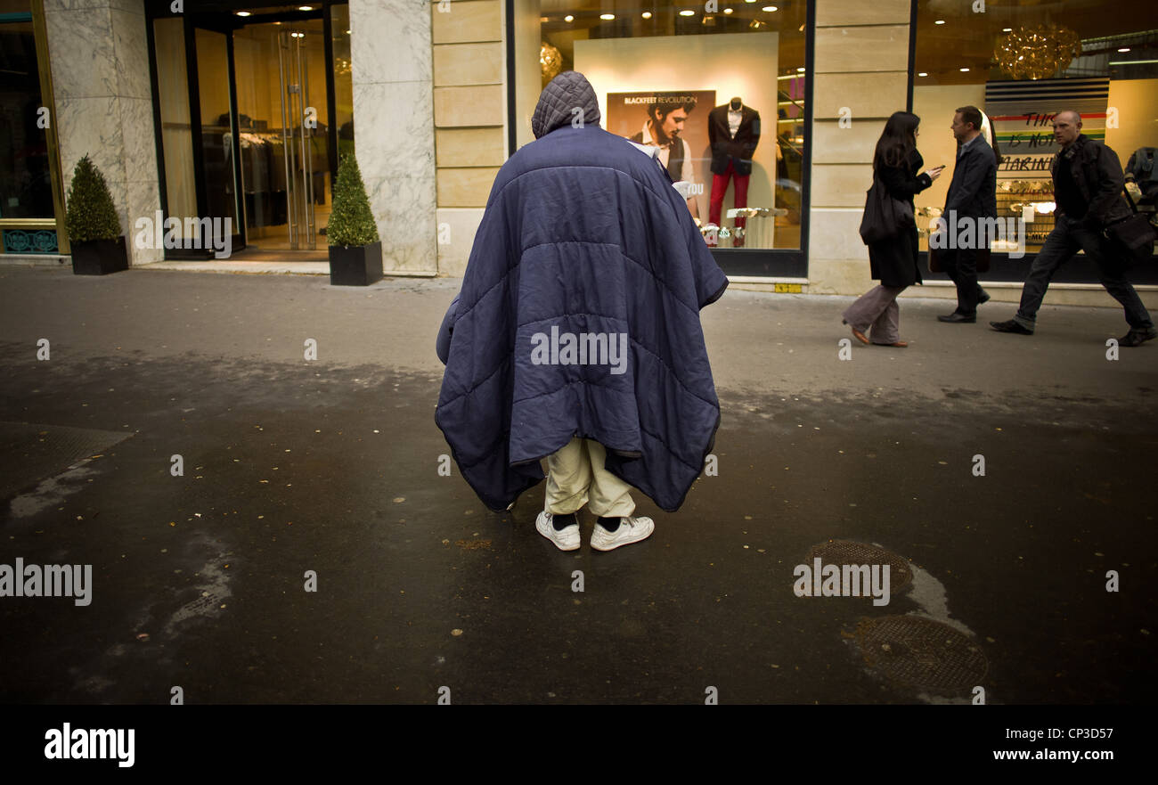Paris urban poverty, Coster-like the homeless superhero Stock Photo - Alamy