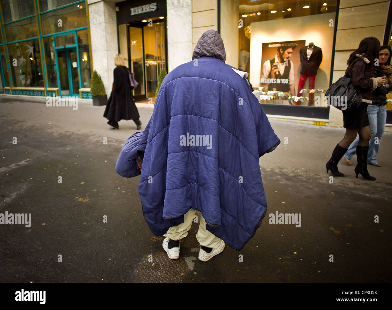 Paris urban poverty, Coster-like the homeless superhero Stock Photo - Alamy