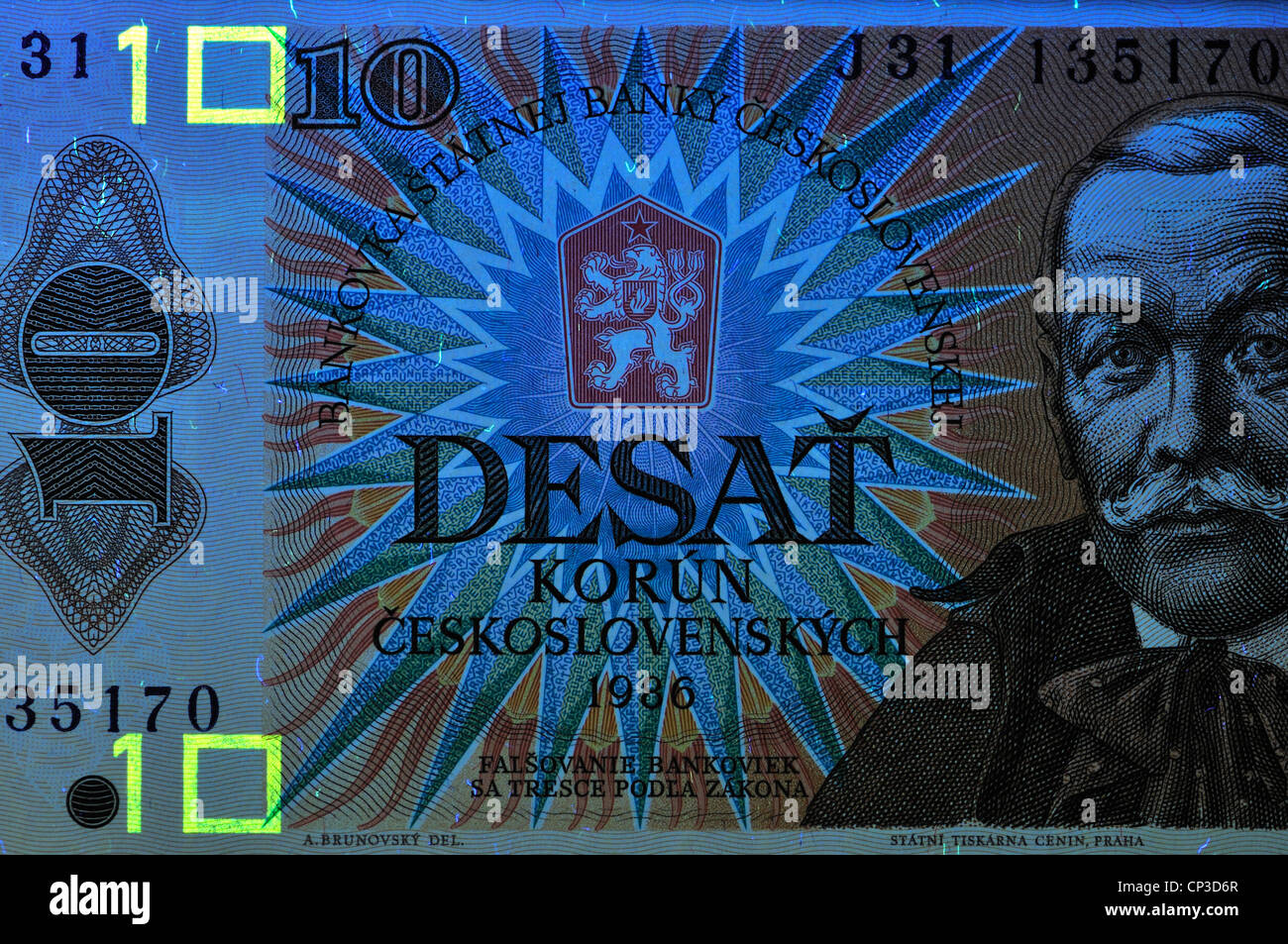 Banknote under ultraviolet light showing security features invisible in ...