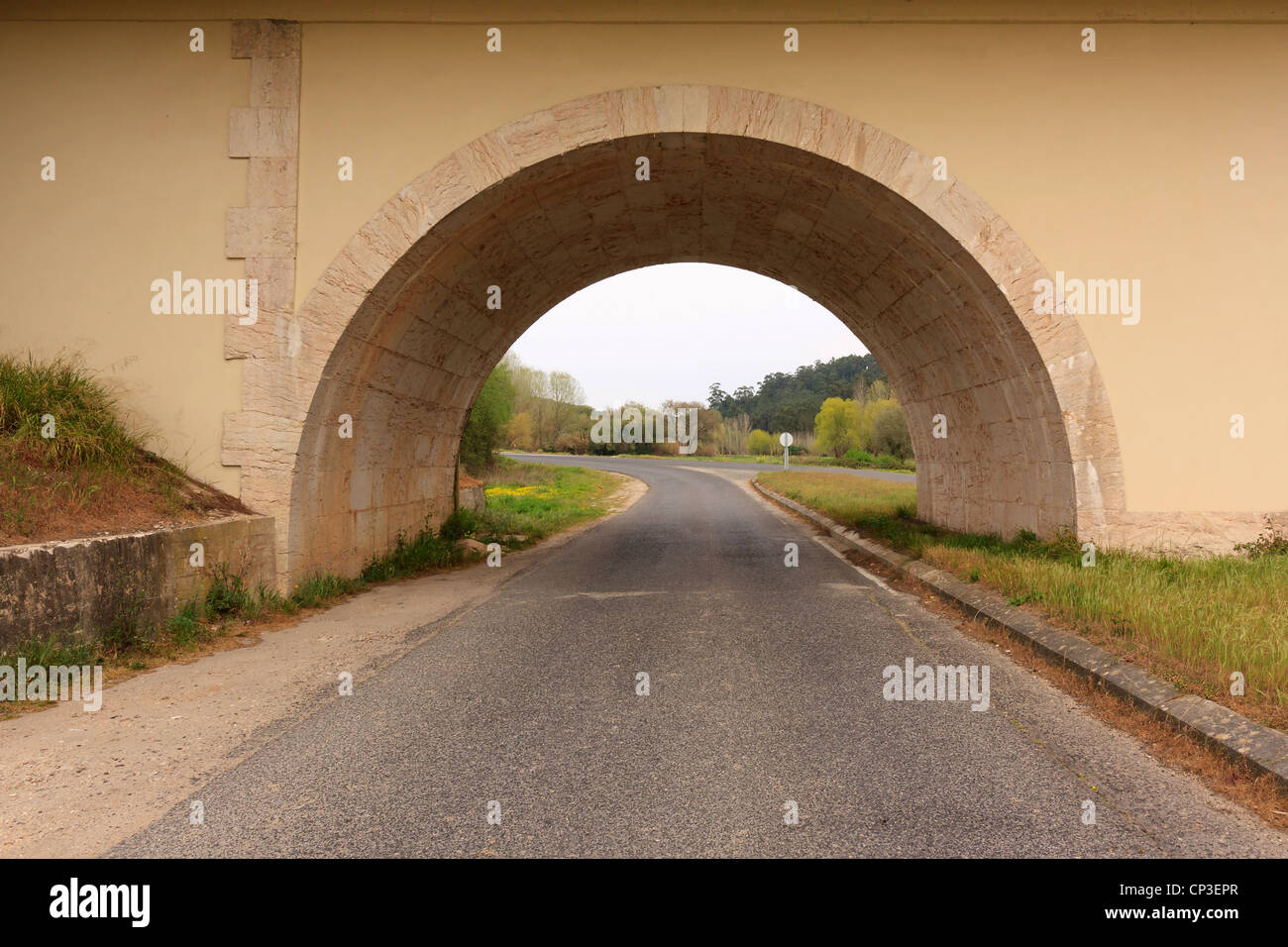Man made road tunnel against woods and cloudy sky Stock Photo - Alamy