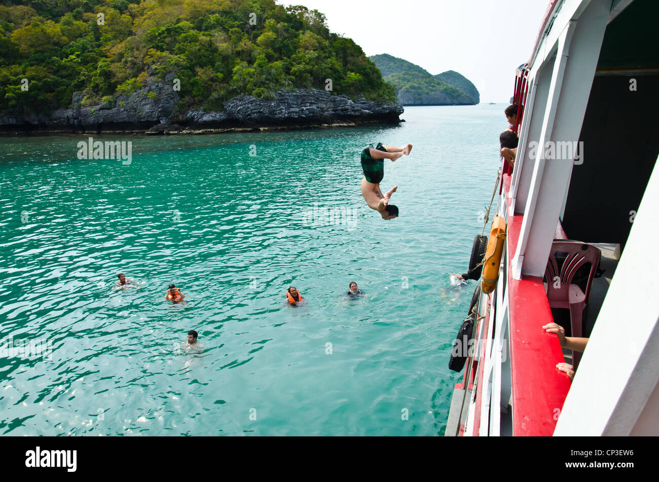 Man jumping sea from boat hi-res stock photography and images - Alamy