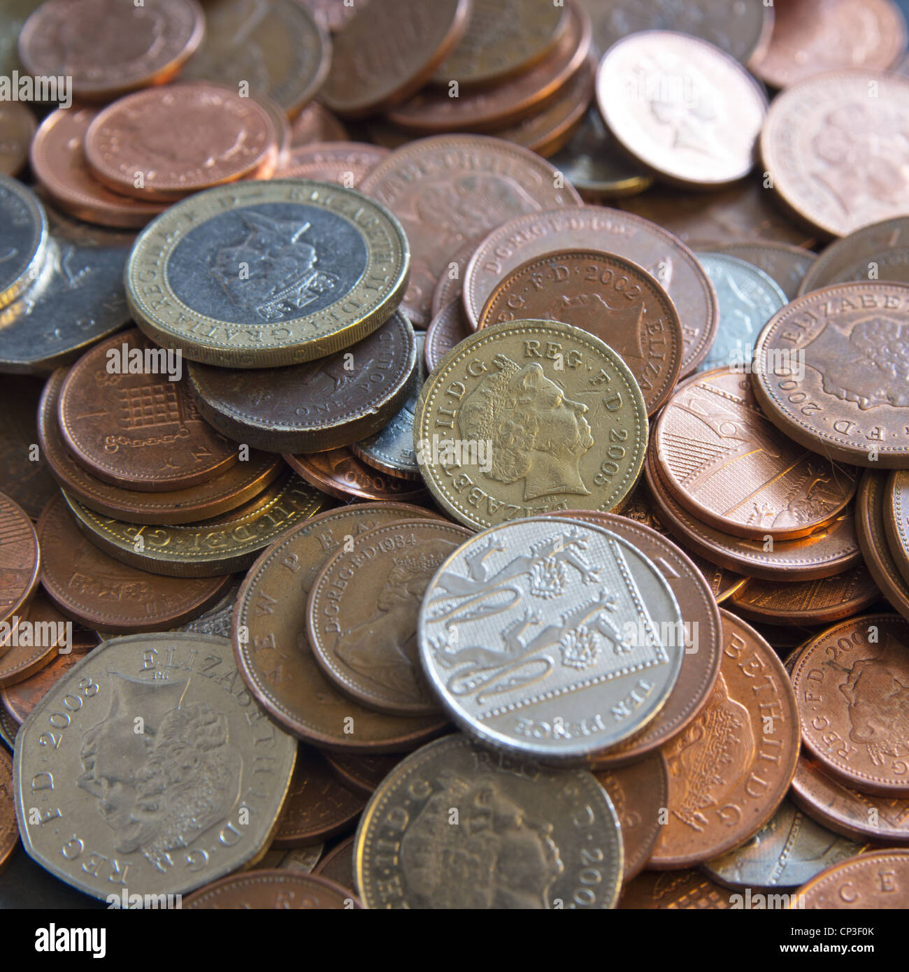 A mound of UK bronze and silver coins Stock Photo - Alamy