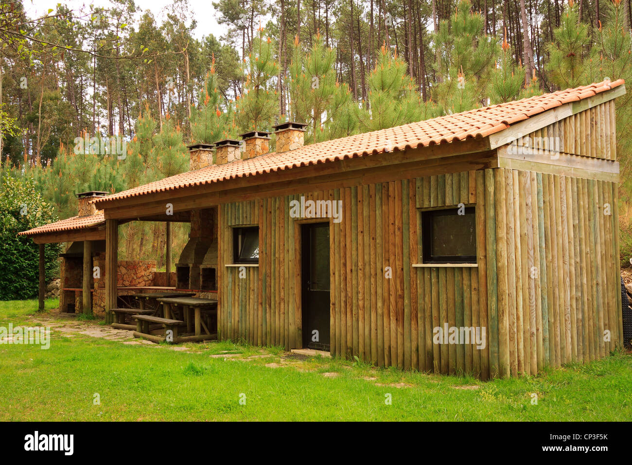 Modern wooden storage house against woods Stock Photo - Alamy