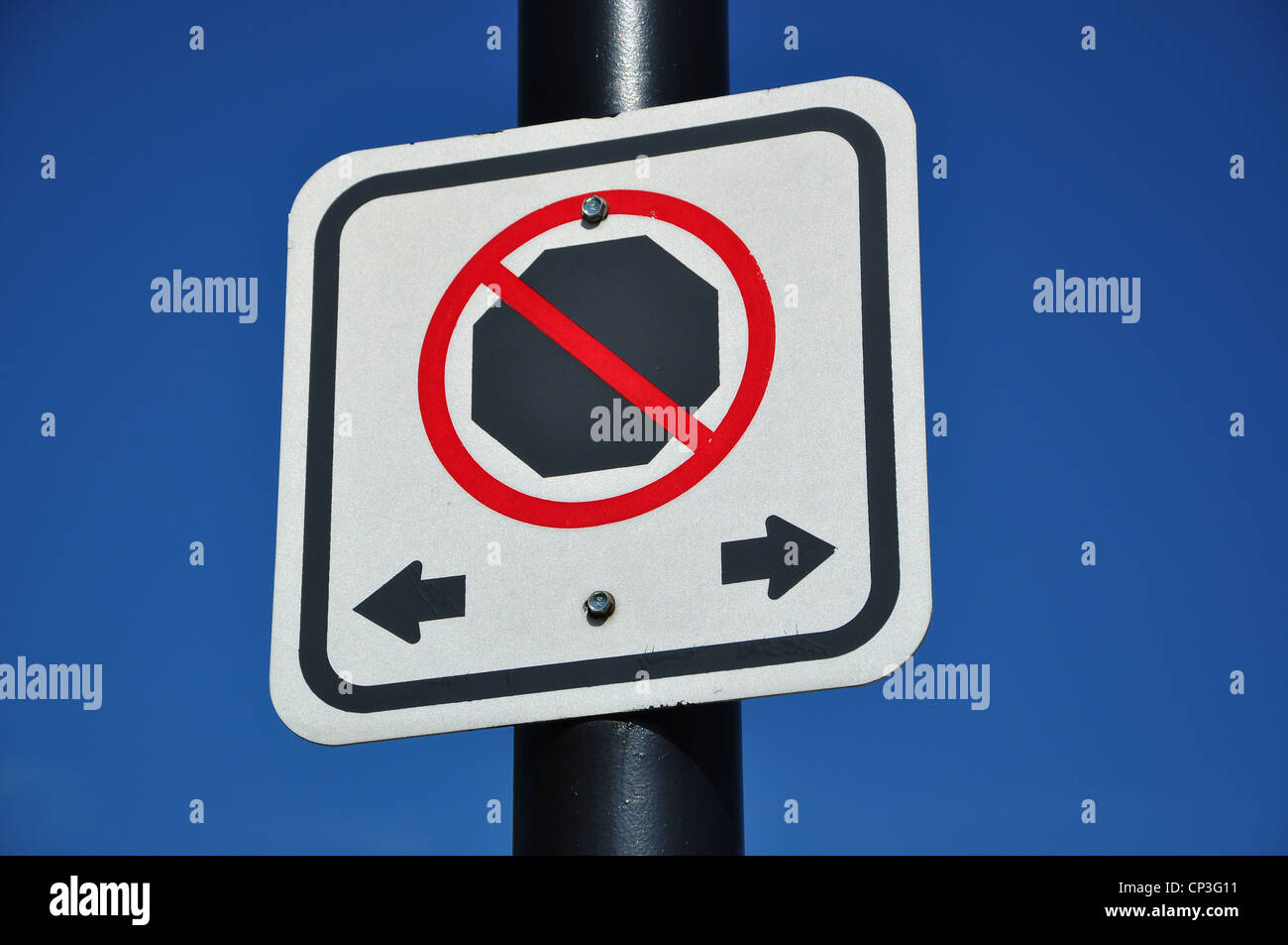 No parking sign against blue sky Stock Photo - Alamy
