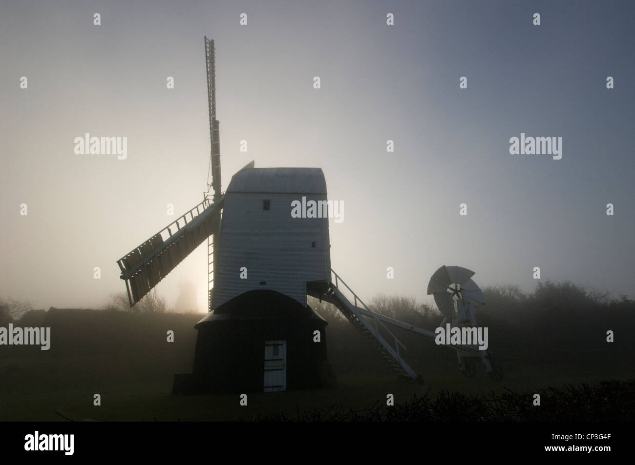 Old English flour windmills in the morning mist: Jack windmill just ...