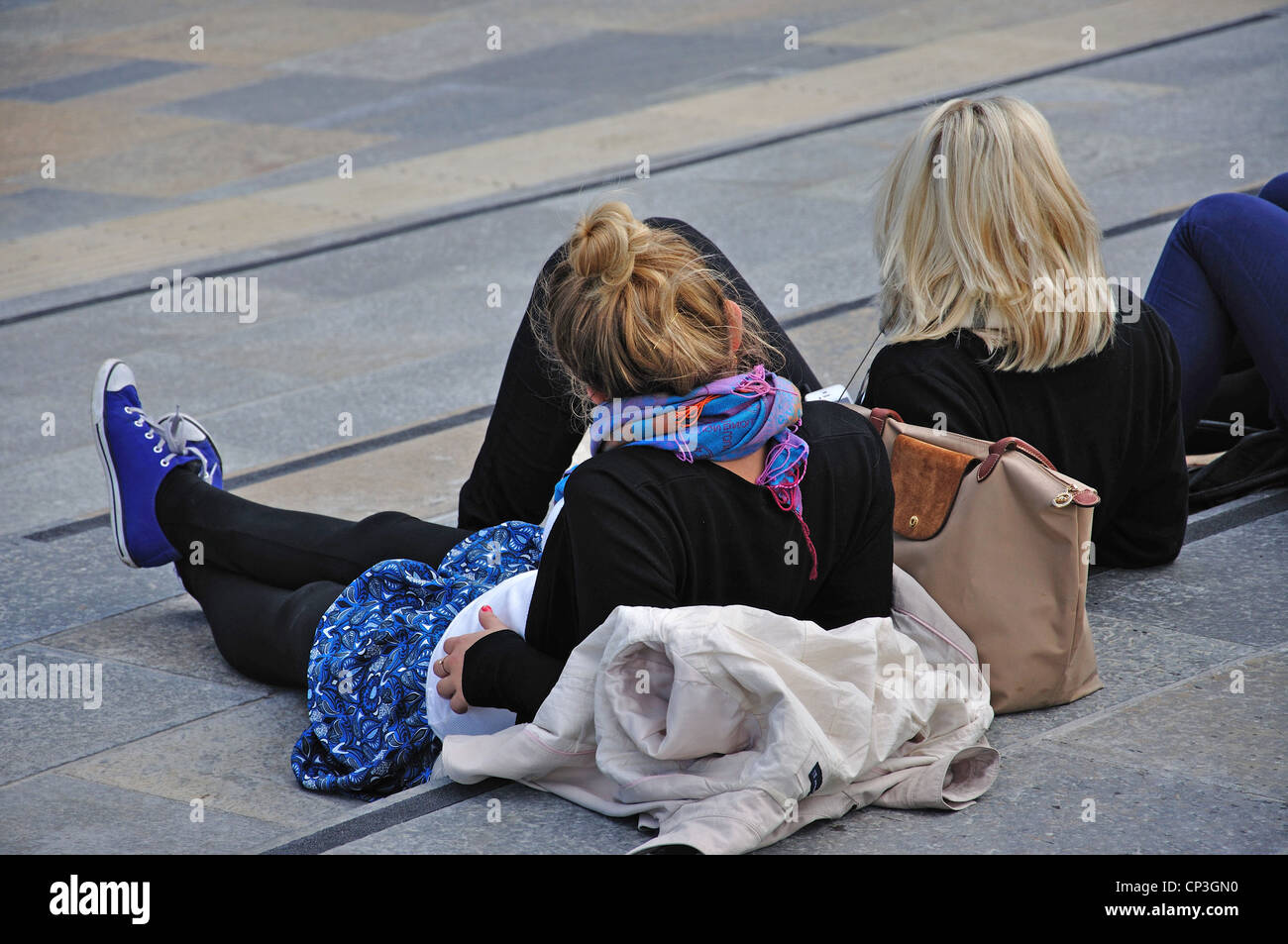 Young female students sitting on path, Greenwich, London Borough of ...