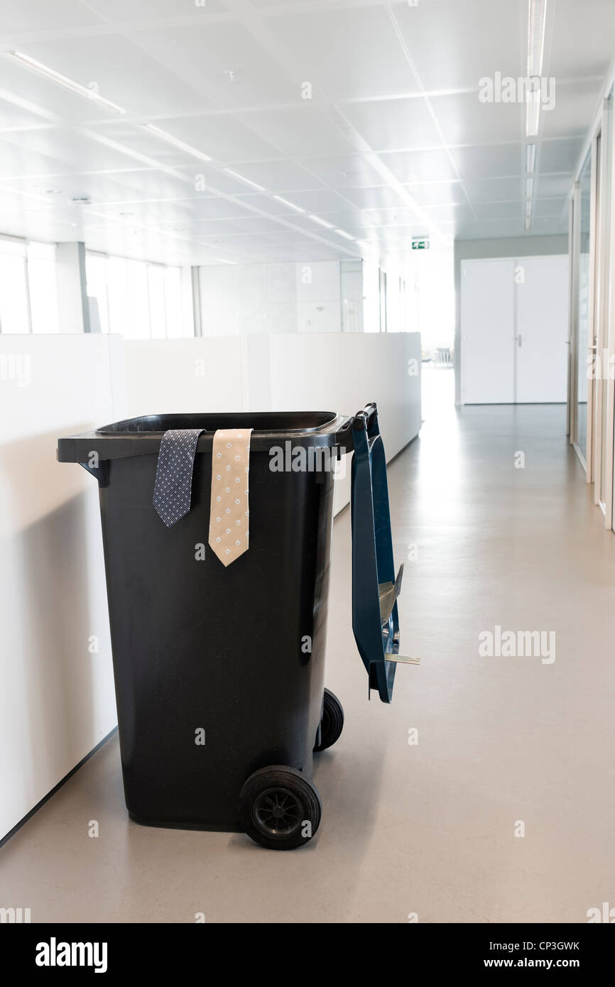 Business ties and garbage bin in empty office Stock Photo - Alamy